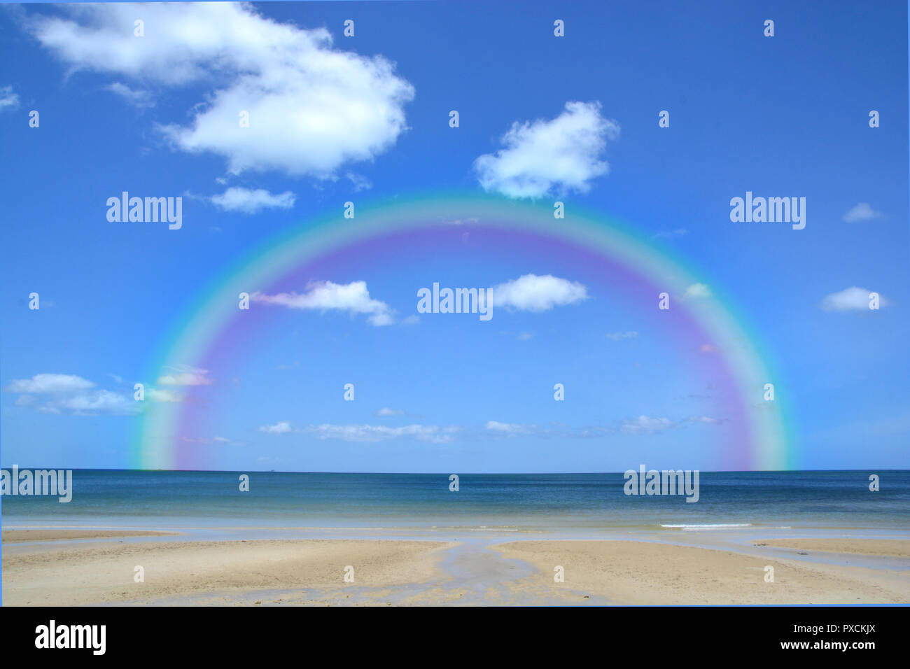 Colorful rainbow over a Tropical beach of Andaman Sea Thailand Stock ...
