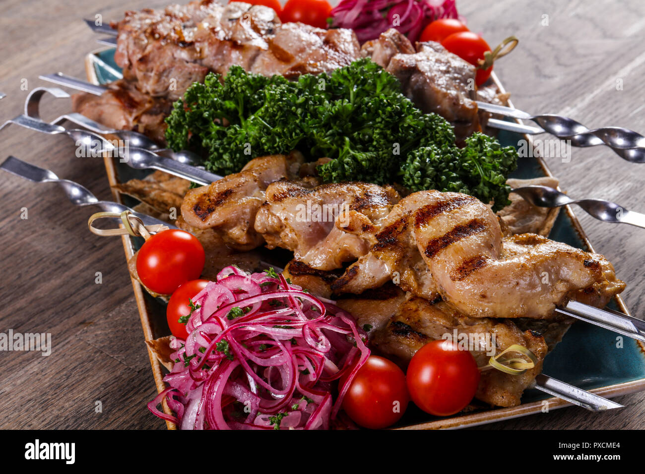 Grilled chicken and pork barbeque Stock Photo - Alamy