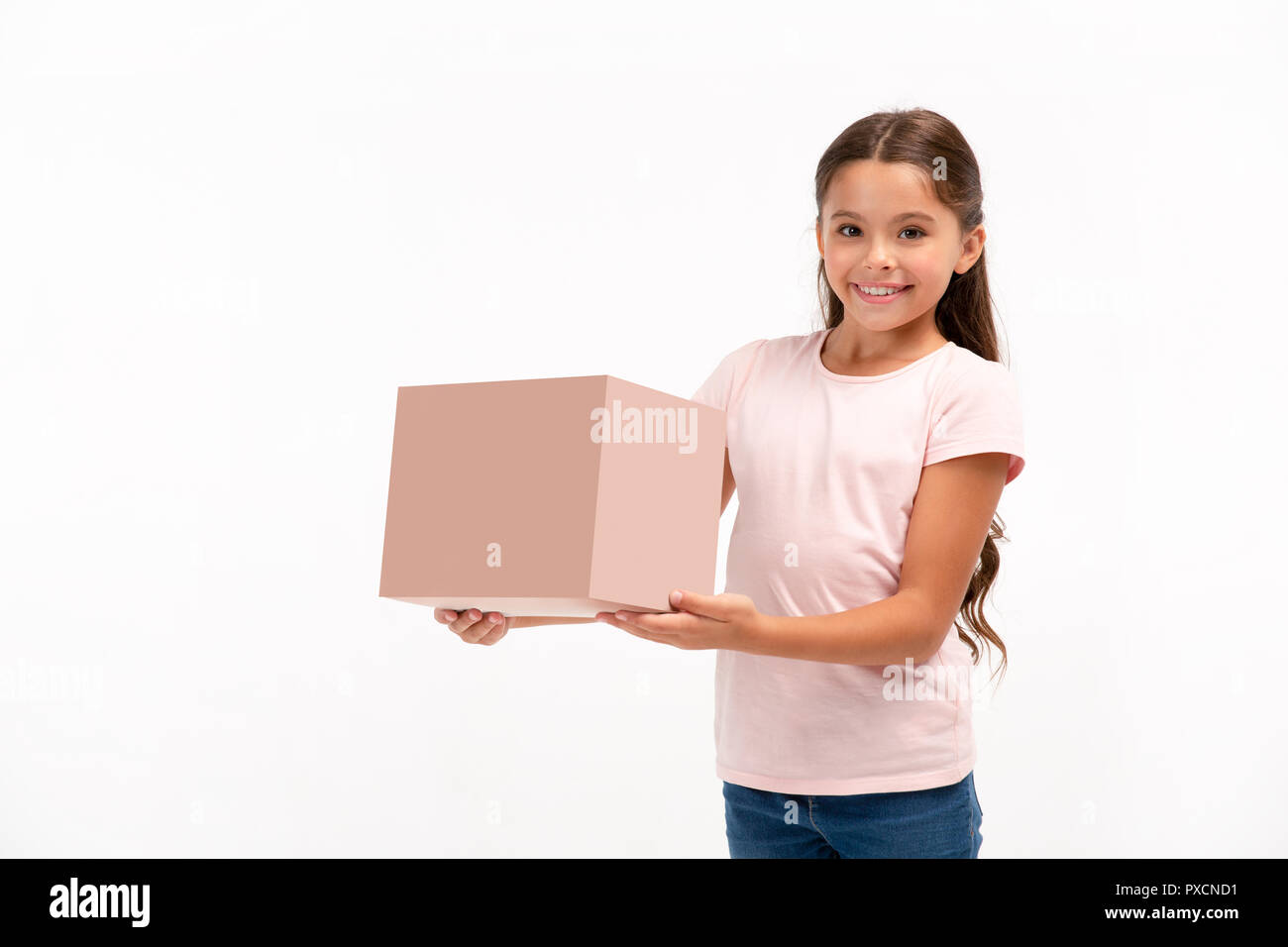 little girl with box isolated over white background. Copy space on the ...