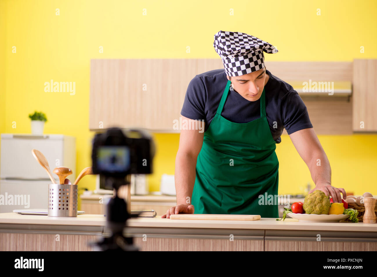 Young chef blogger explaining food preparation Stock Photo - Alamy