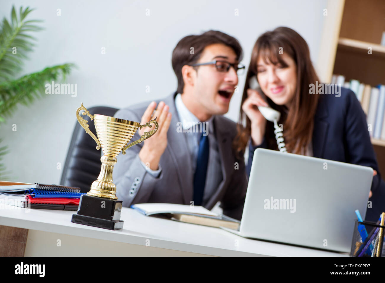 Concept of teamwork with prize Stock Photo - Alamy