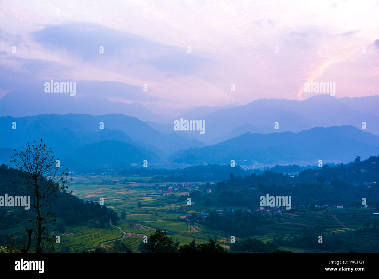 Farm field and layered hills Stock Photo - Alamy