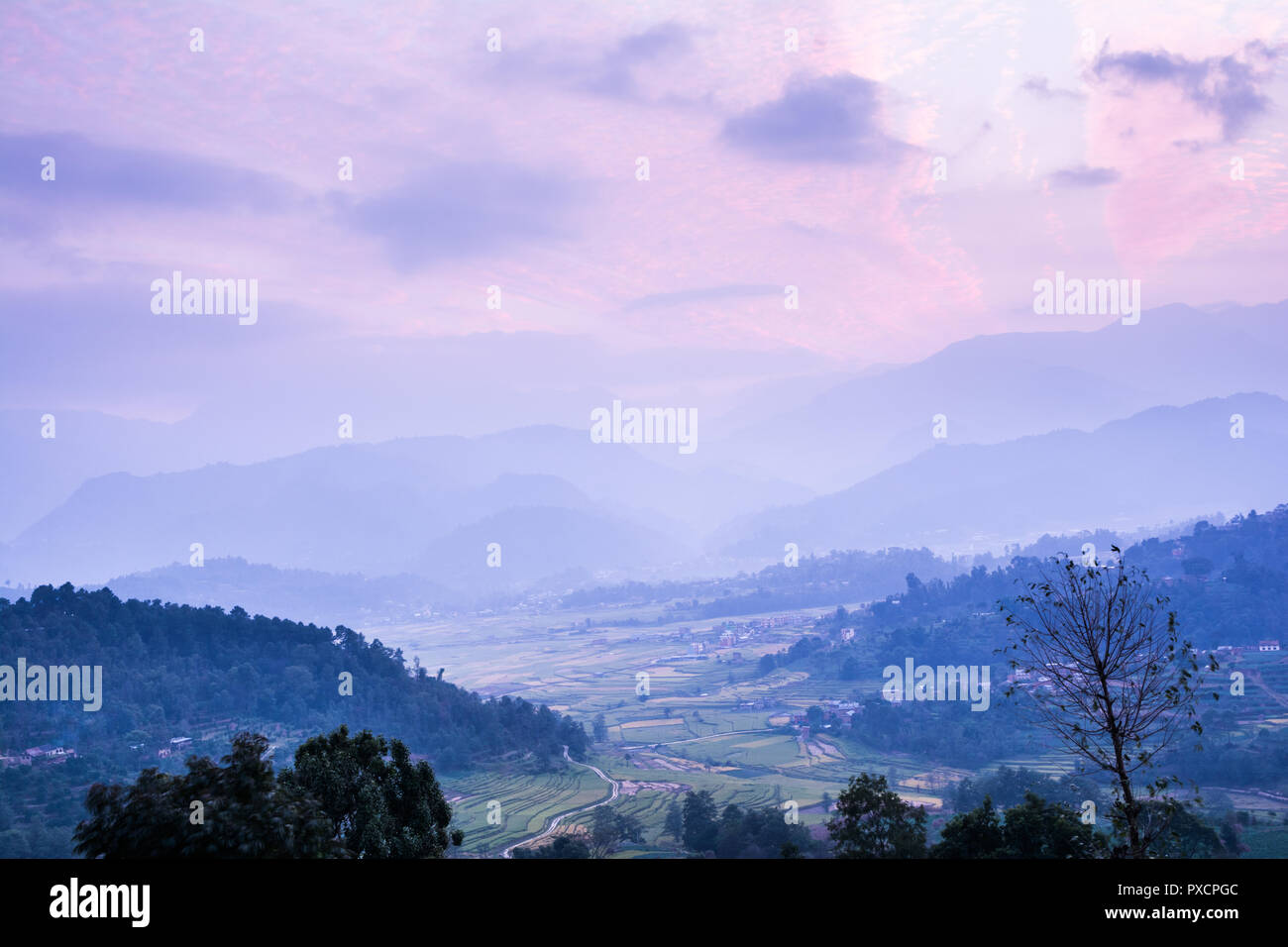 Farm field and layered hills Stock Photo - Alamy