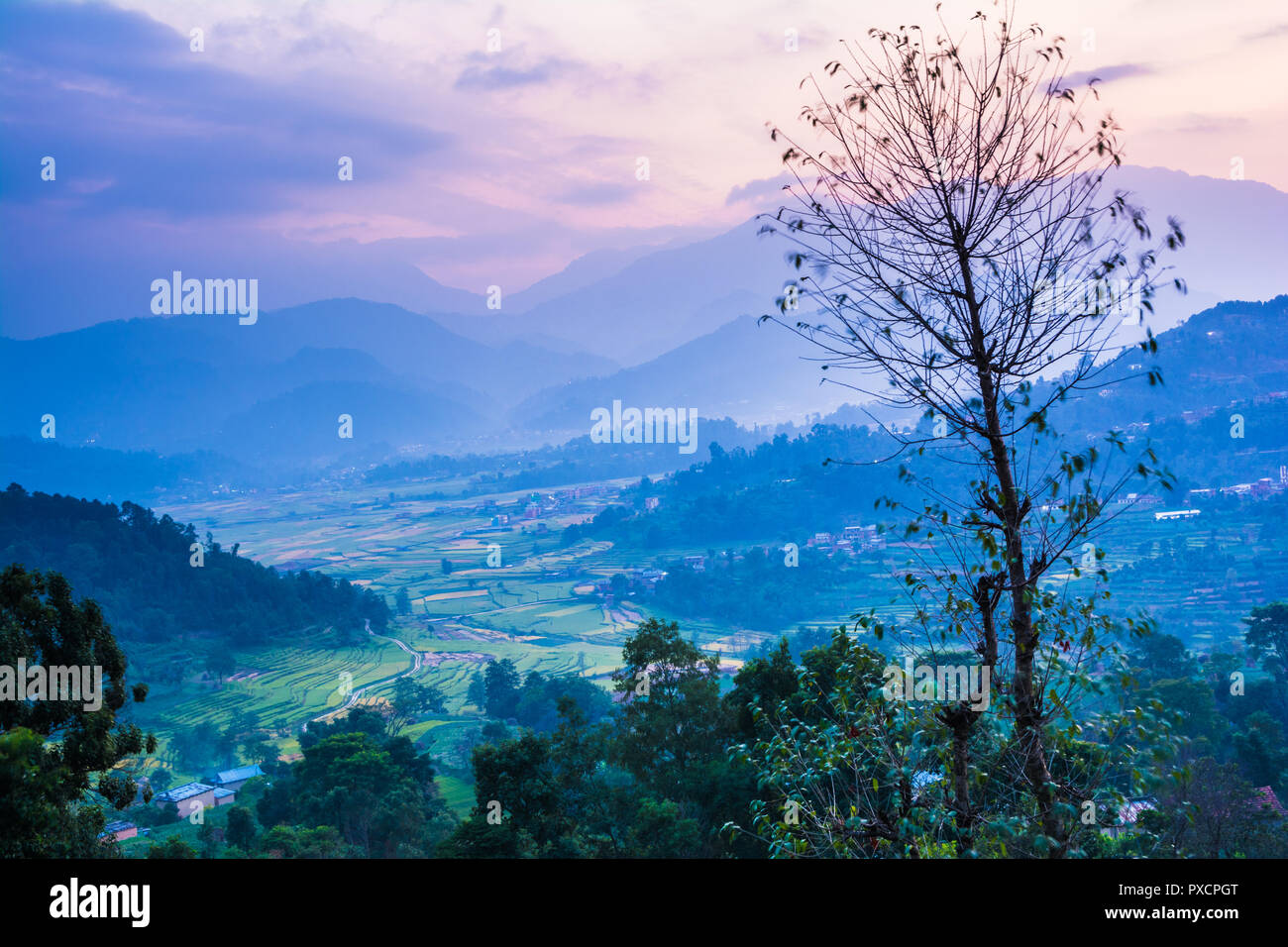 Farm field and layered hills Stock Photo - Alamy