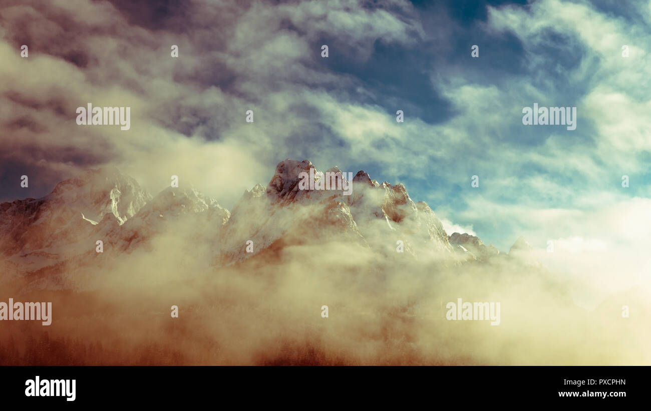 Clouds surrounding the italian alps after the snowfall Stock Photo - Alamy