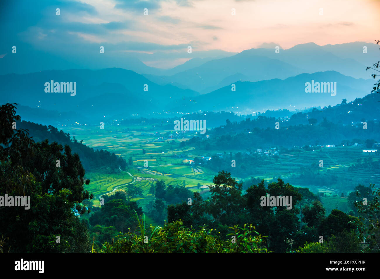 Farm field and layered hills Stock Photo - Alamy
