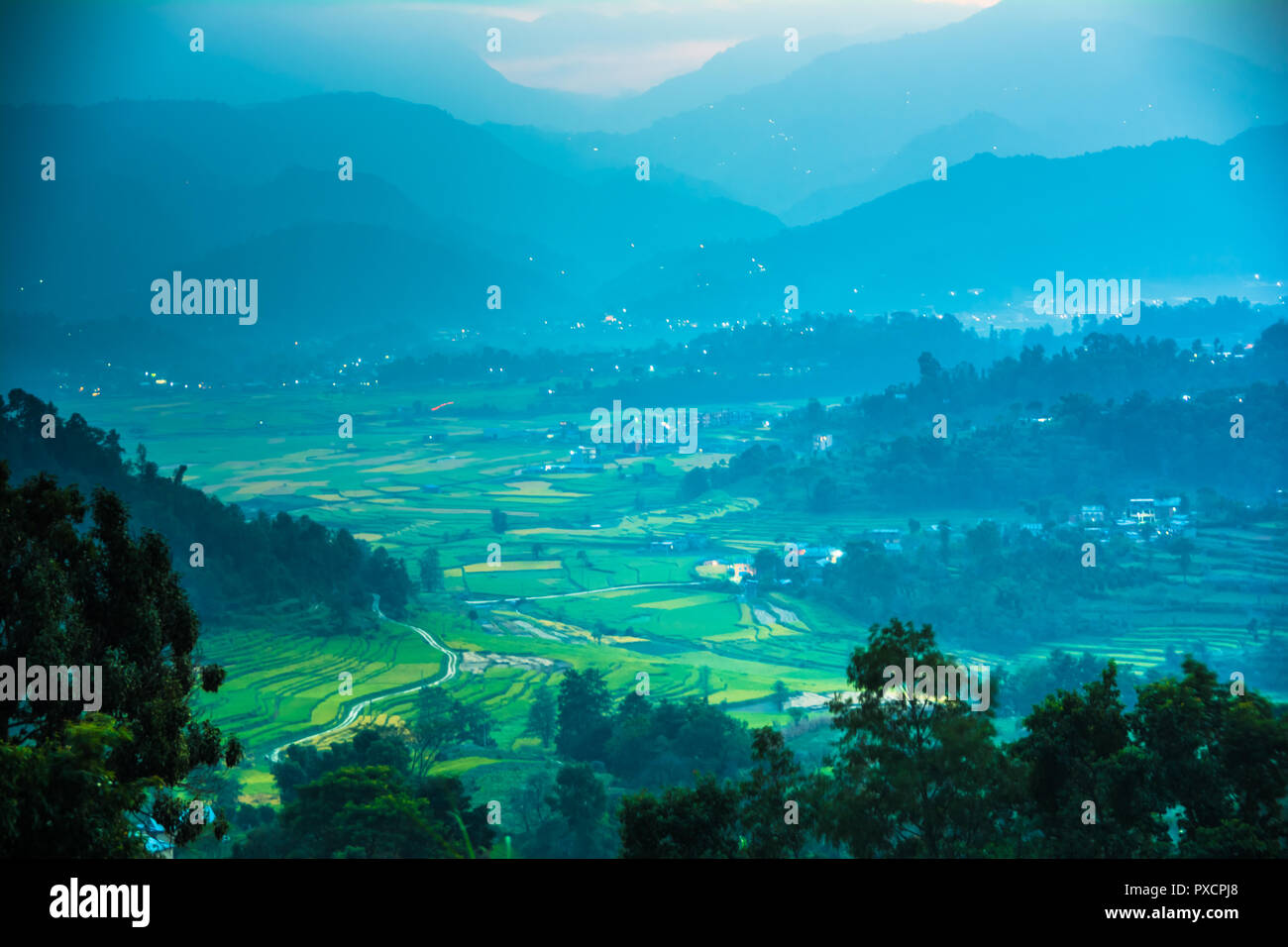 Farm field and layered hills Stock Photo - Alamy