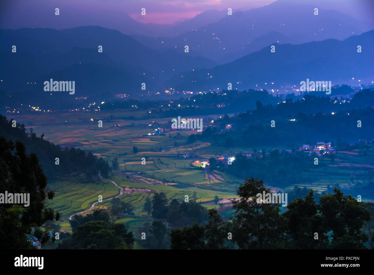 Farm field and layered hills Stock Photo - Alamy