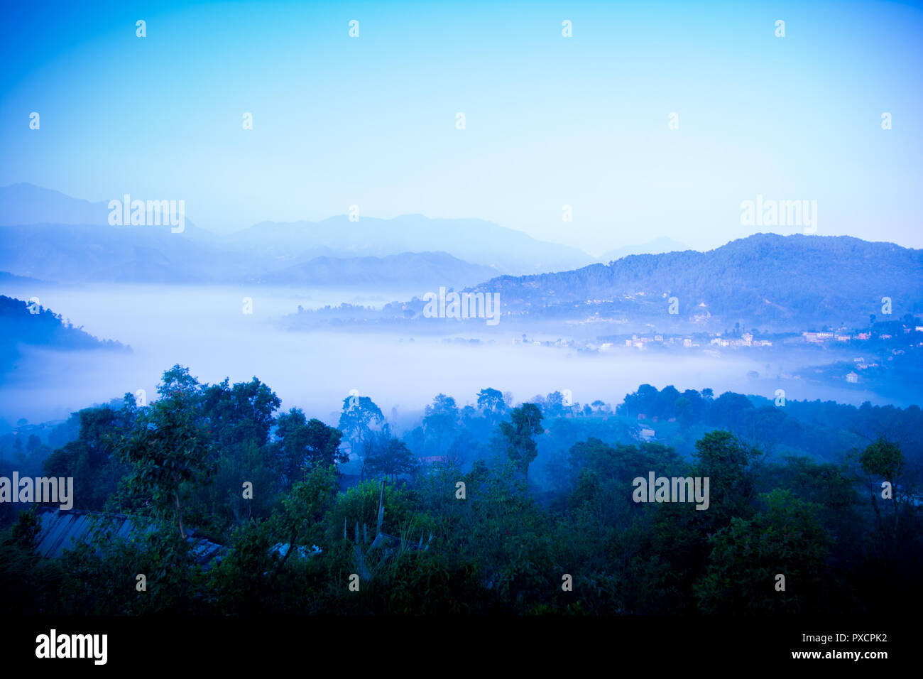 Village land covered by fog Stock Photo - Alamy