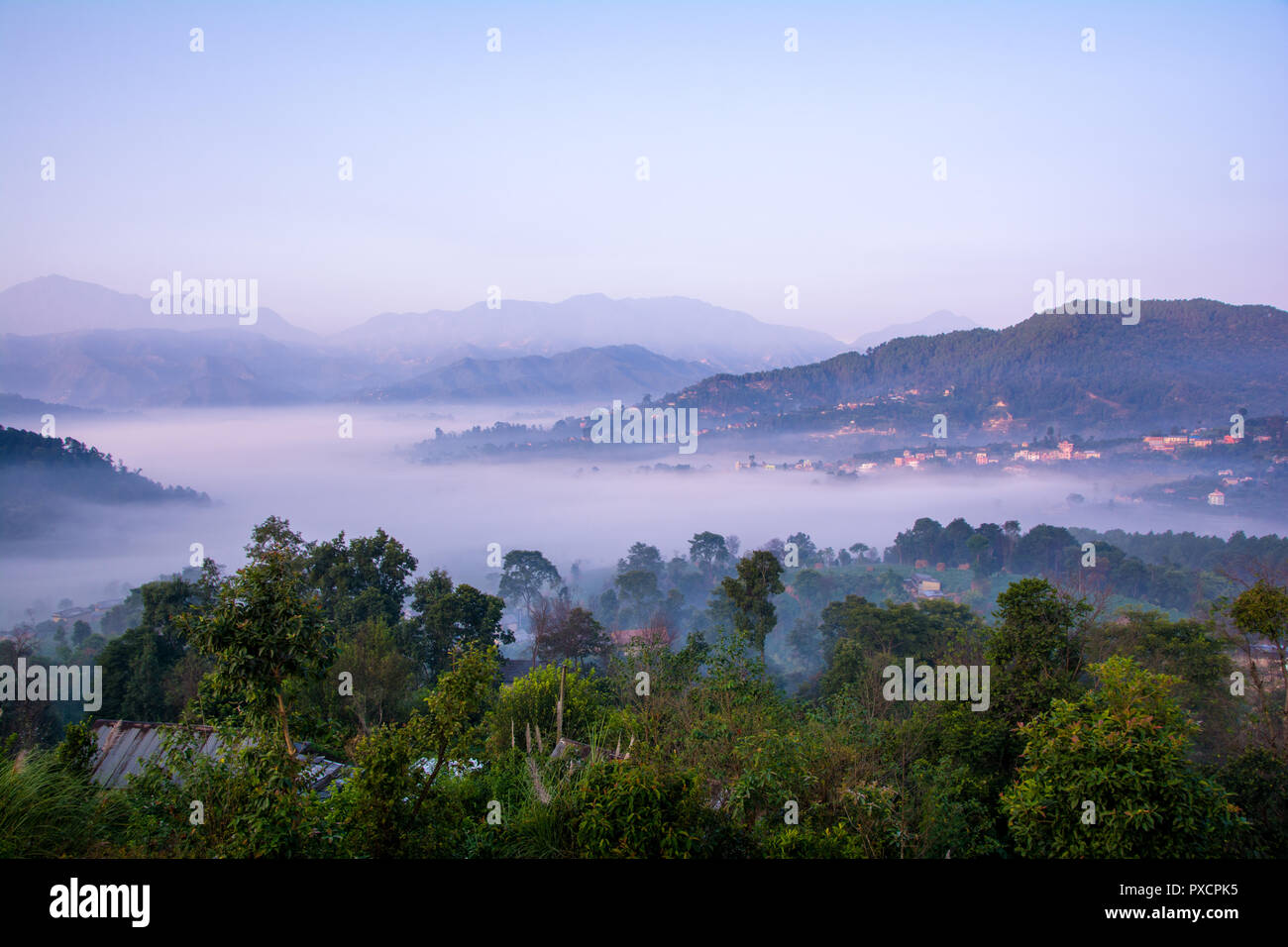 Village land covered by fog Stock Photo - Alamy