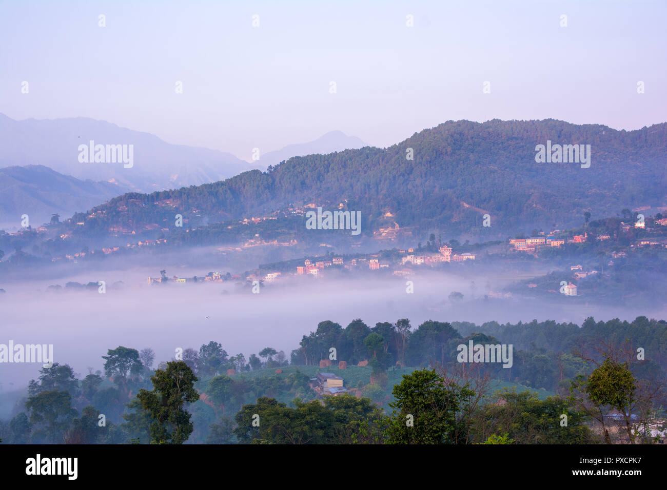 Village land covered by fog Stock Photo - Alamy