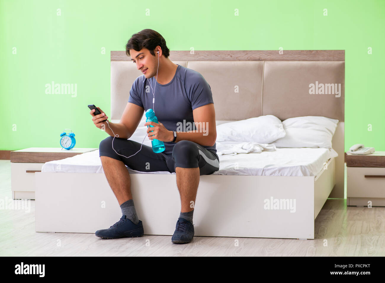 Young handsome man doing morning exercises in the hotel room Stock ...