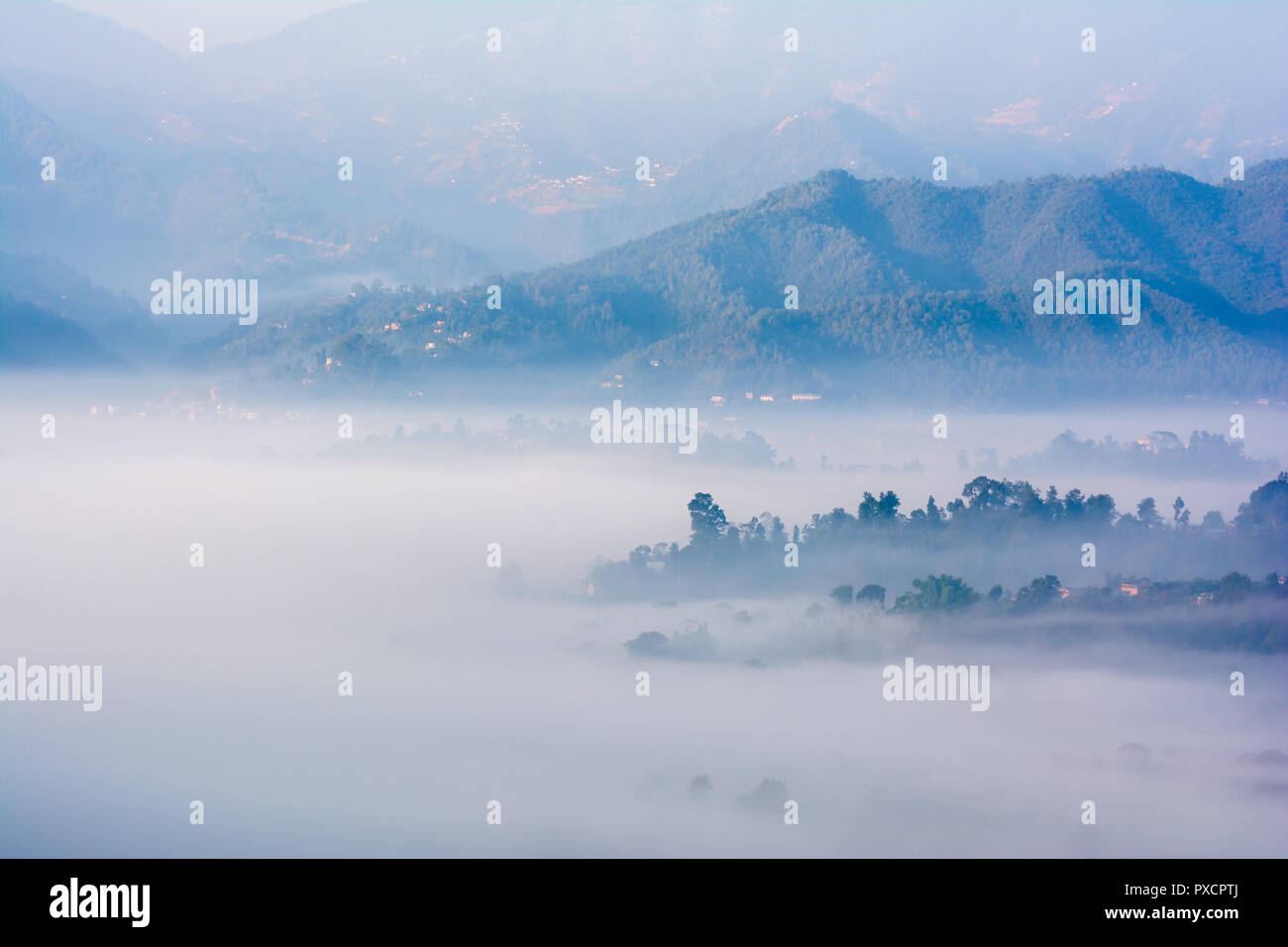 Village land covered by fog Stock Photo - Alamy