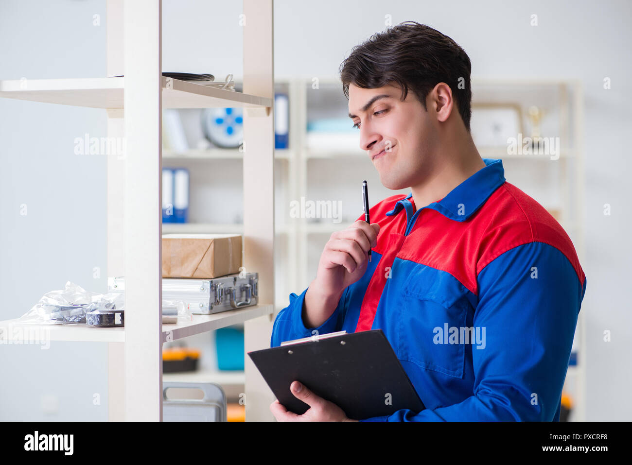 Man working in the postal warehouse Stock Photo - Alamy