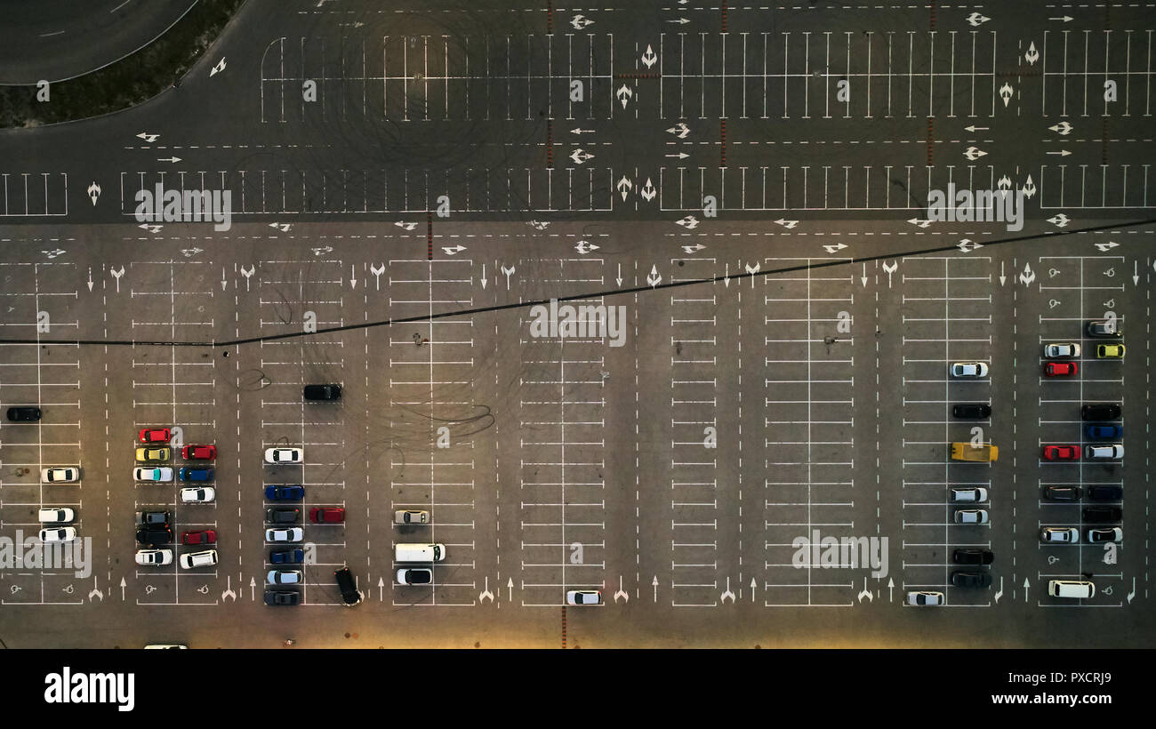 Aerial top view of parking lot with many cars from above ...