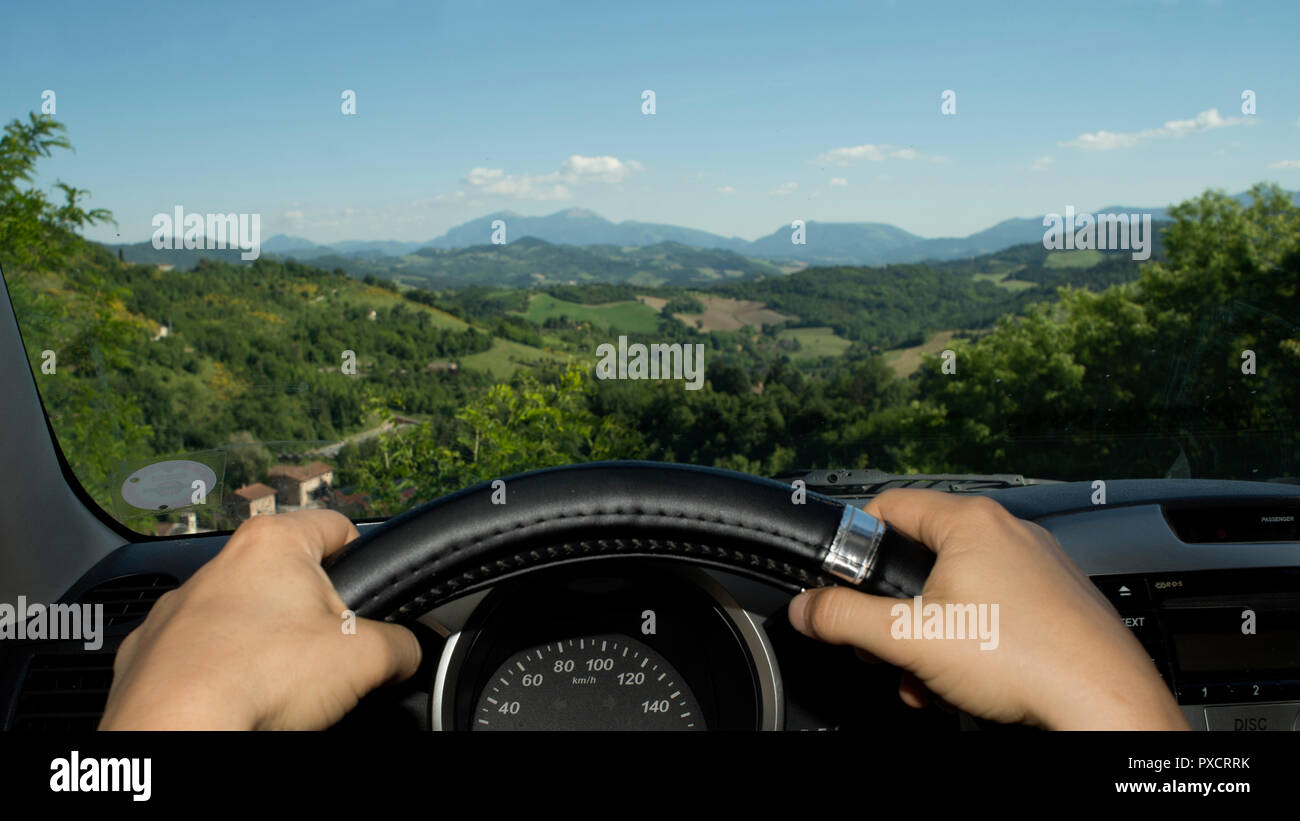 hands on a steering wheel Stock Photo - Alamy