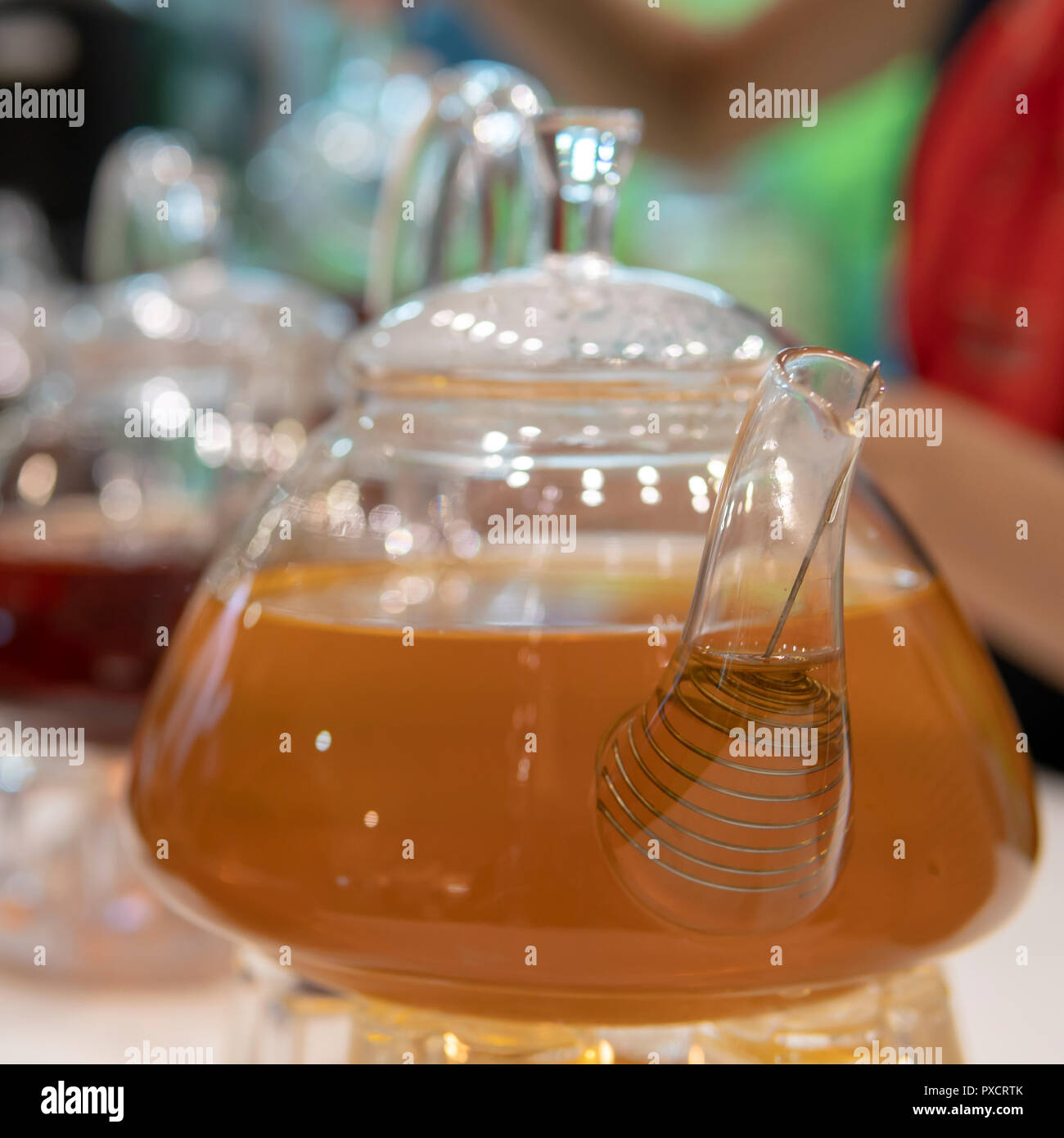 Tea in a glass transparent teapot Stock Photo - Alamy