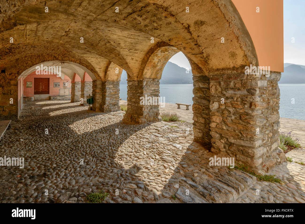 arched covered walkway just on lake shore at historical touristic ...