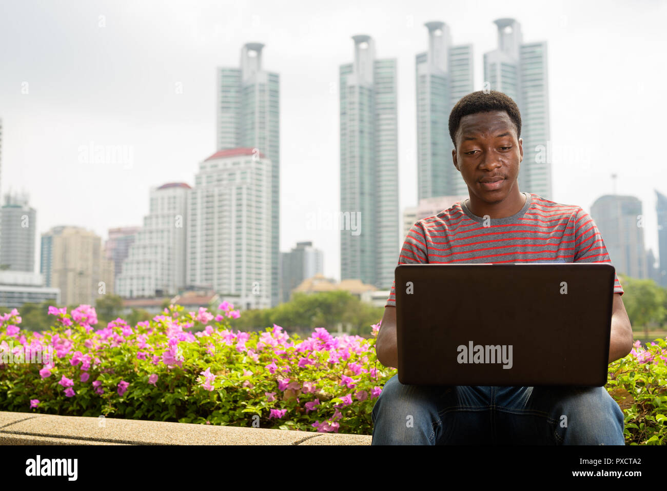 Afro young man in laptop hi-res stock photography and images - Alamy