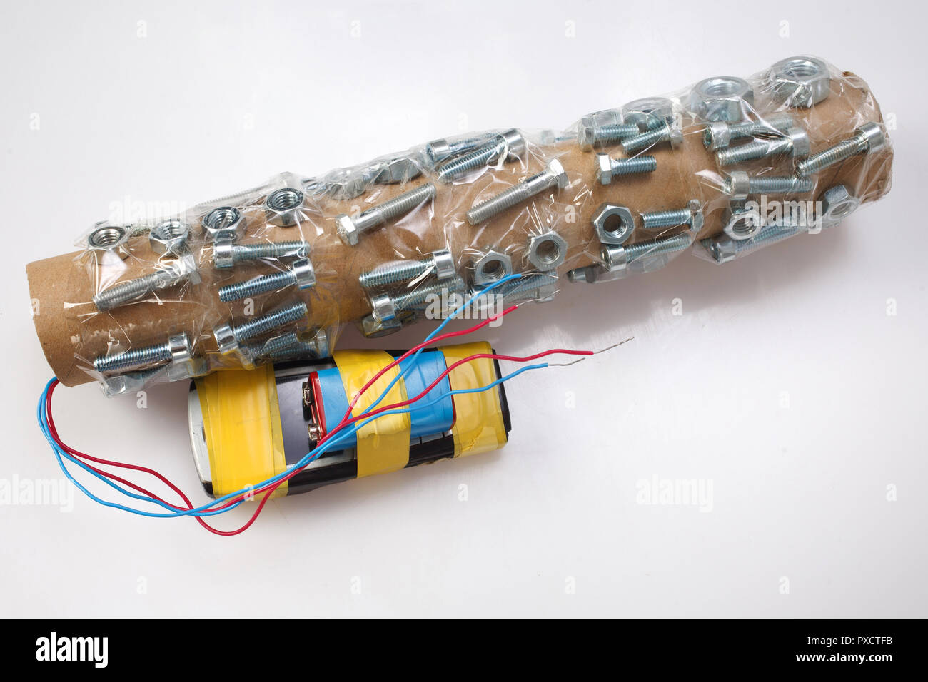 Handmade pipe bomb with cell phone firing device on white background ...