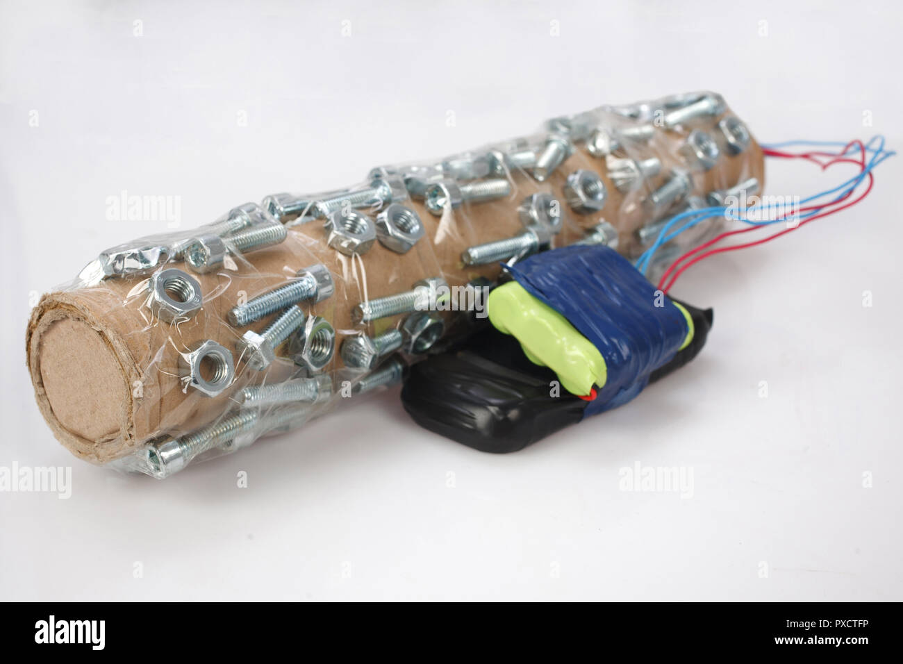 Handmade pipe bomb with cell phone firing device on white background ...