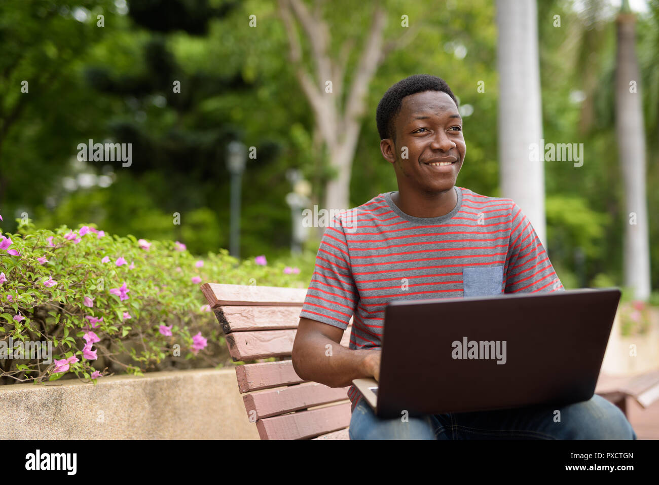 African american happy laptop hi-res stock photography and images - Alamy