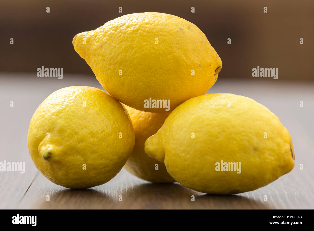 group of four whole lemons, placed one above the other, citrus Stock ...