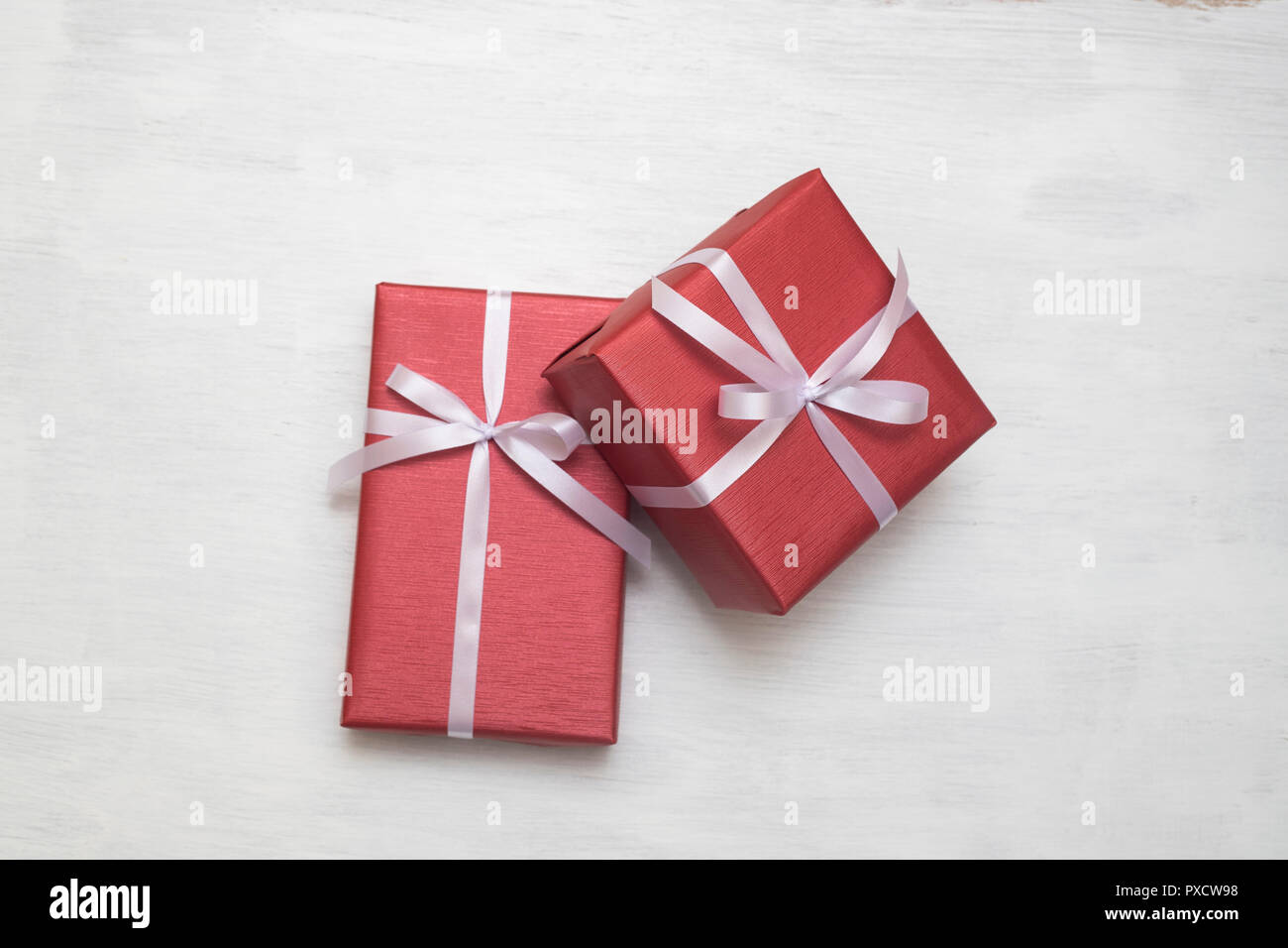 Two Red gift box with white ribbon isolated on white background., to ...