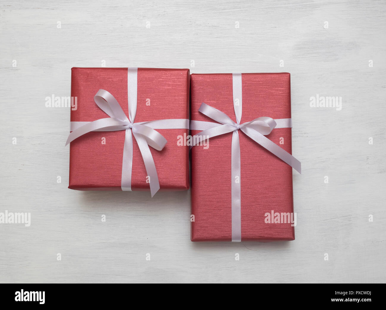 Two Red gift box with white ribbon isolated on white background, to ...