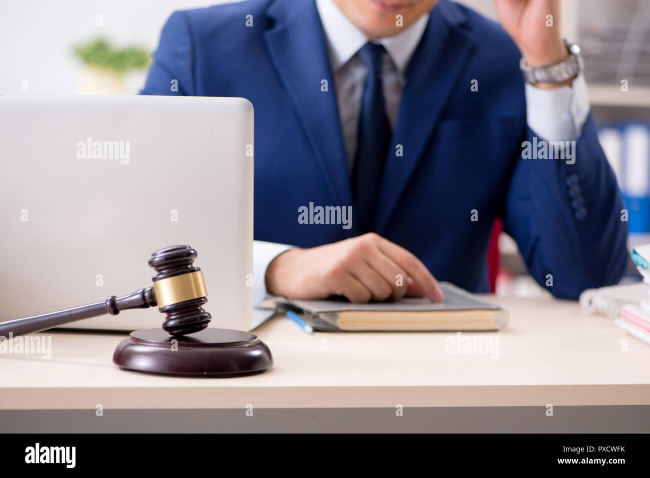 Young handsome judge working in court Stock Photo - Alamy