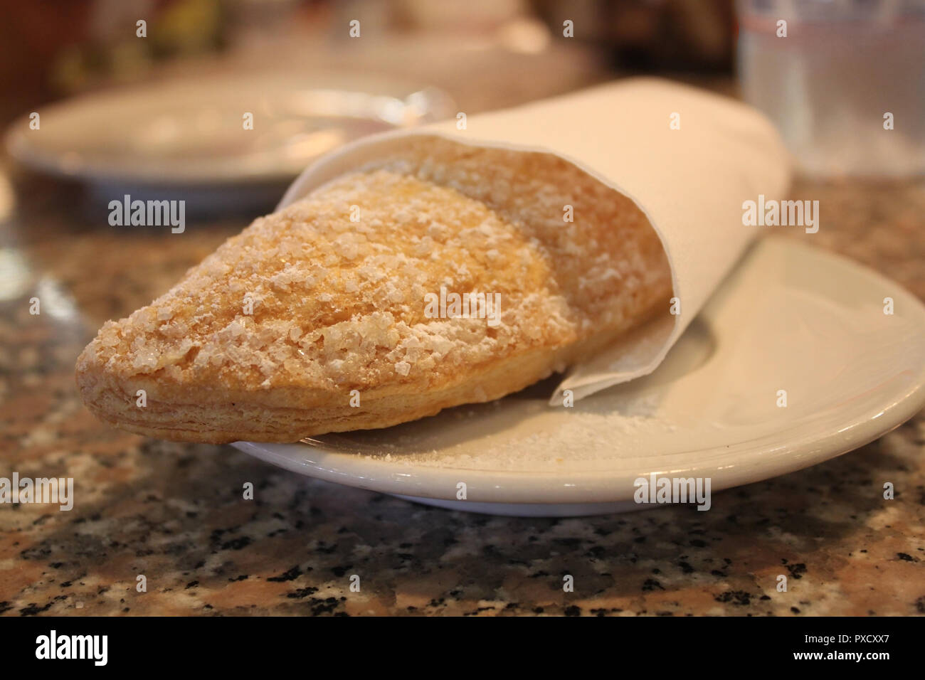 A Italian pastry in a plate wrapped with a tissue in a cafe Stock Photo ...