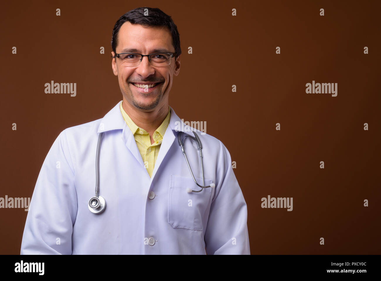 Happy male doctor looking camera hi-res stock photography and images ...