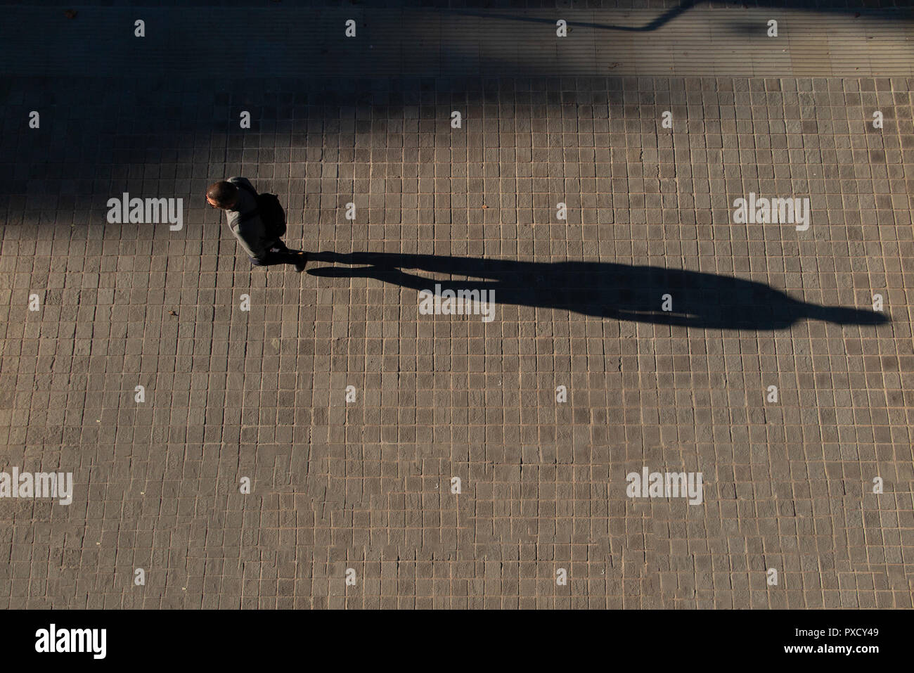 Shadows cast people walking hi-res stock photography and images - Alamy
