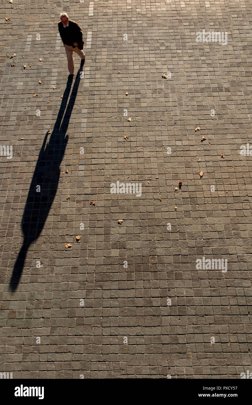 Walking casting long shadows hi-res stock photography and images - Alamy