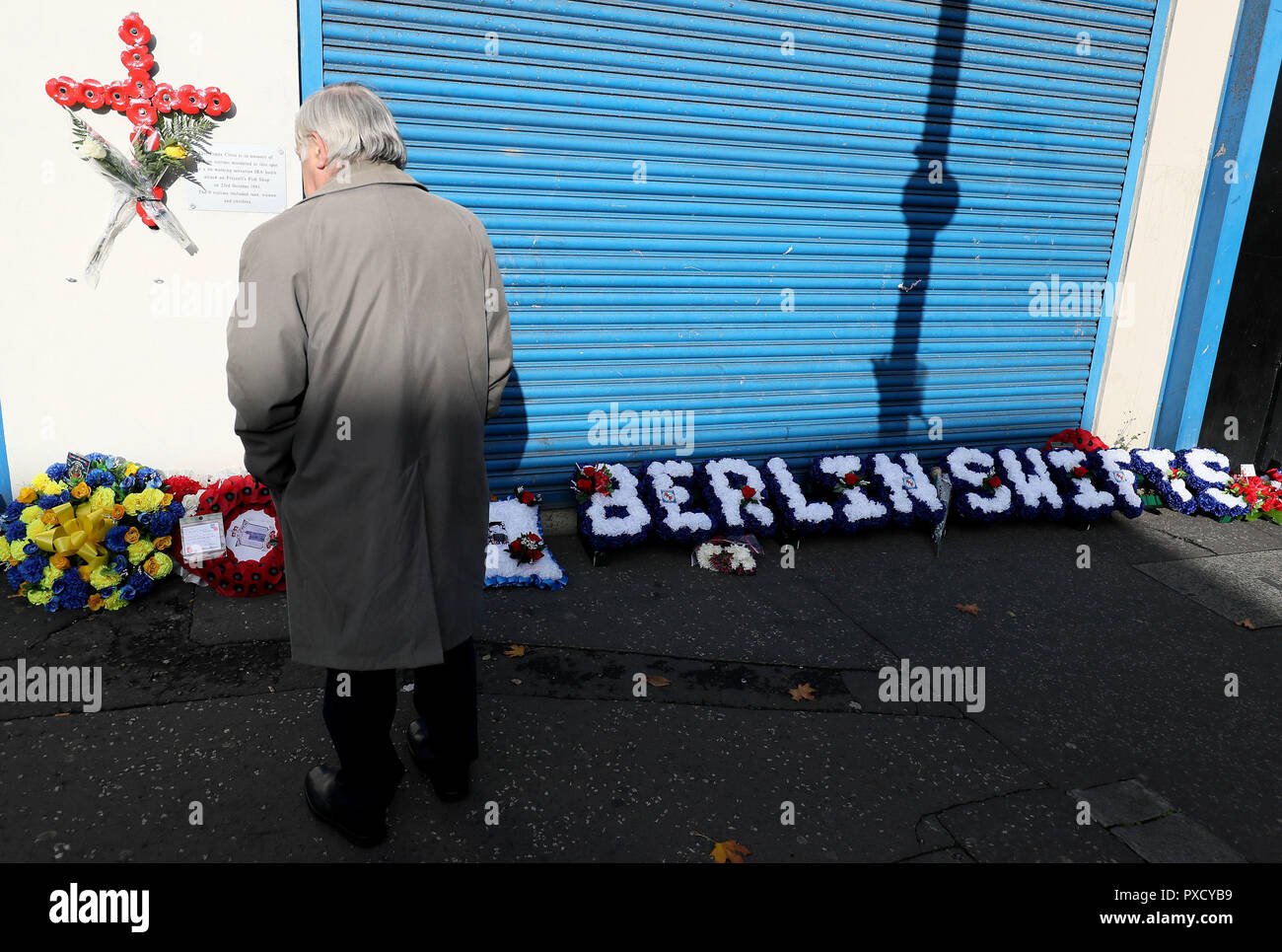 A man stops at the site of the Shankill Road bomb in Belfast where nine ...