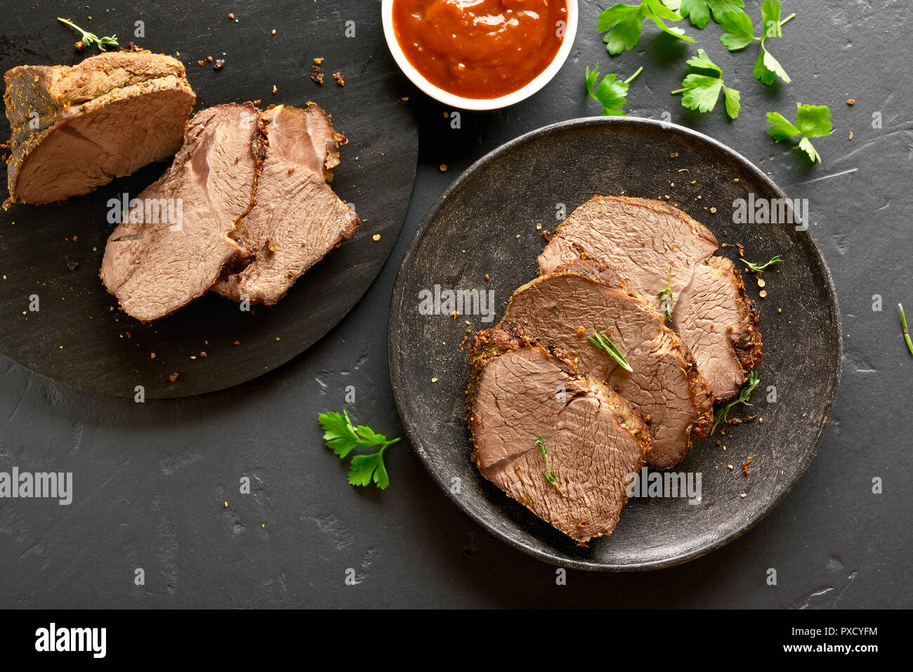 Tasty sliced grilled roast beef on plate. Top view Stock Photo - Alamy