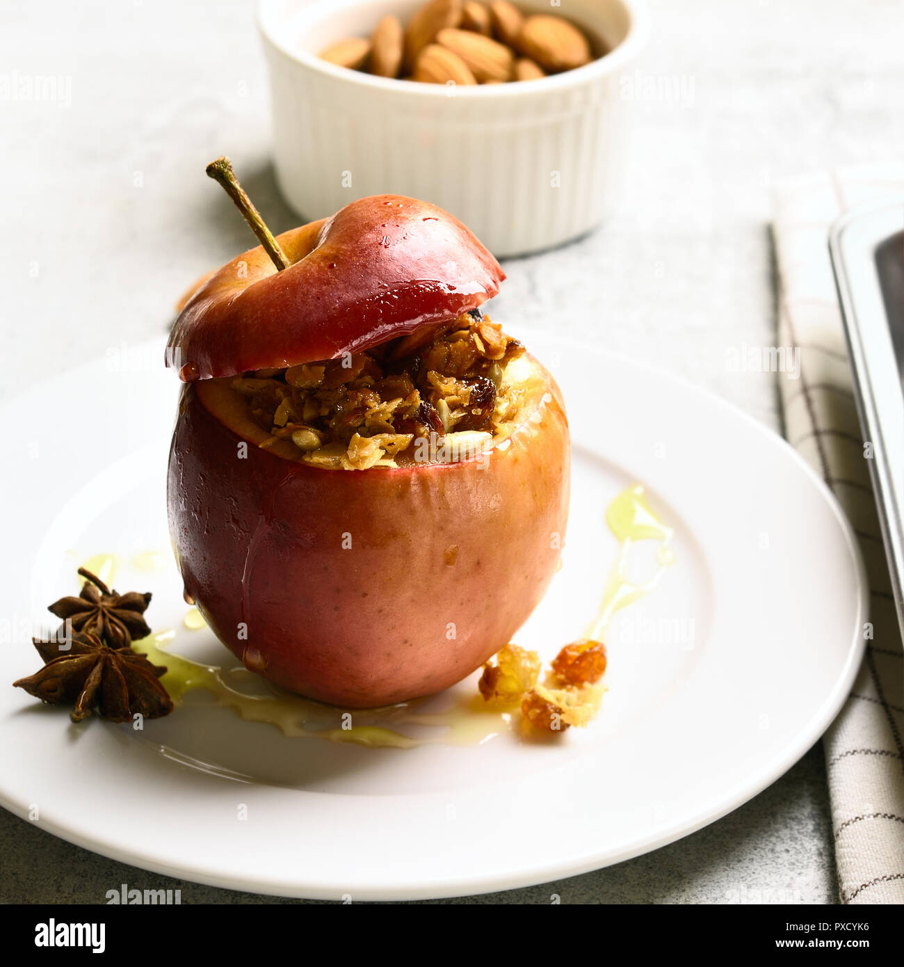 Appetizing baked apple with granola, cinnamon, nuts and honey. Healthy ...