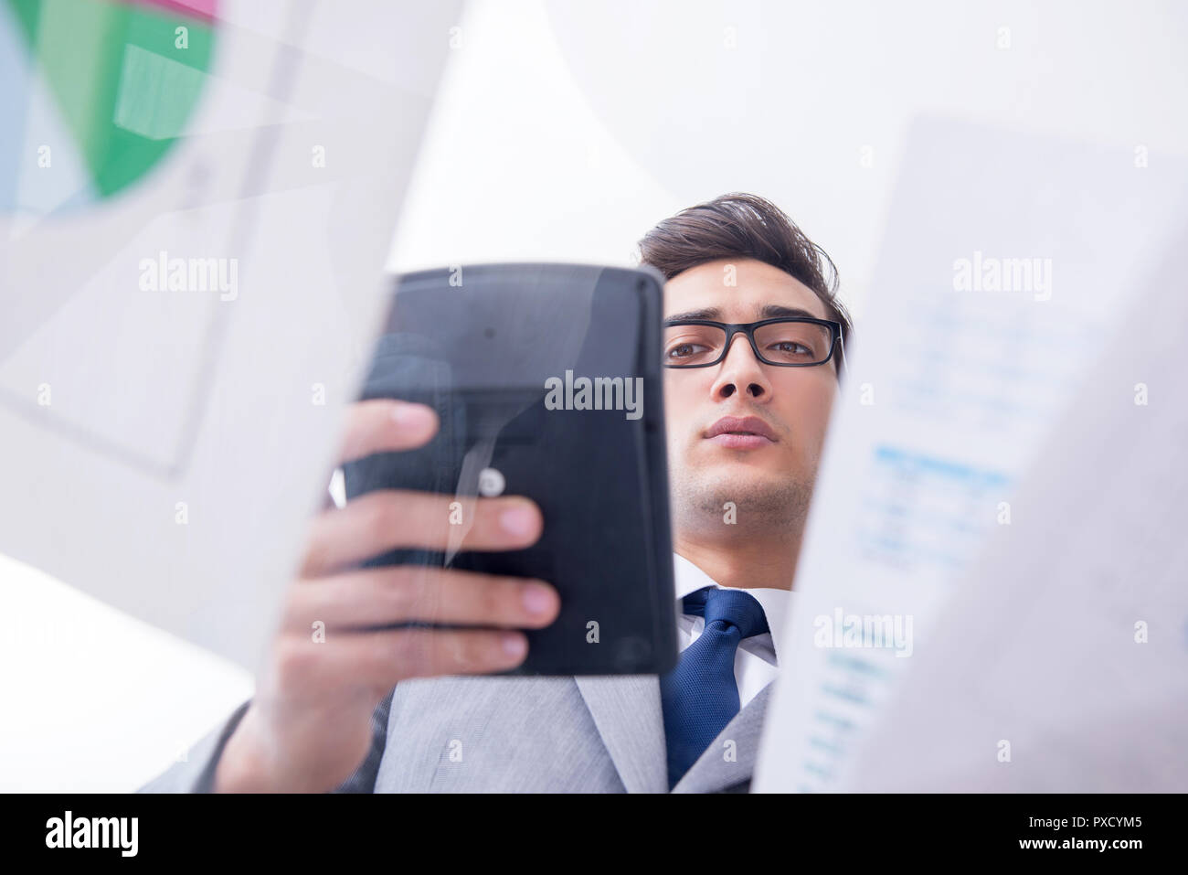Businessman looking at financial charts and graphs Stock Photo - Alamy