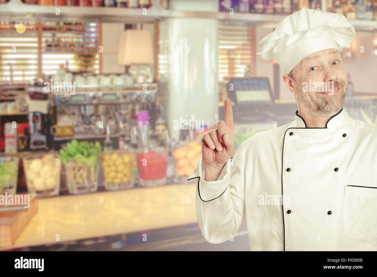 The chef is a white man in uniform with a bar counter Stock Photo - Alamy