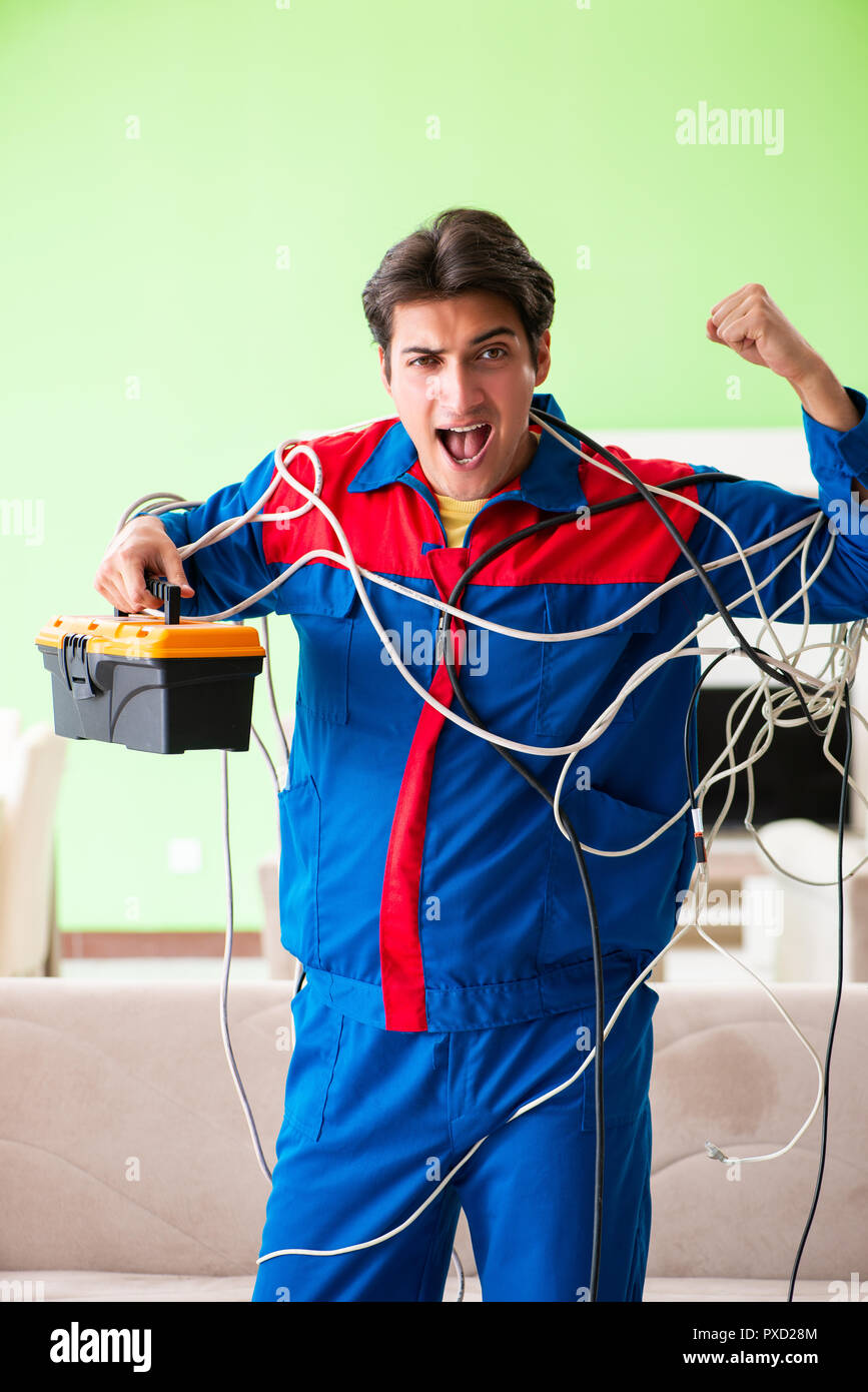 Electrician contractor with tangled cables Stock Photo - Alamy