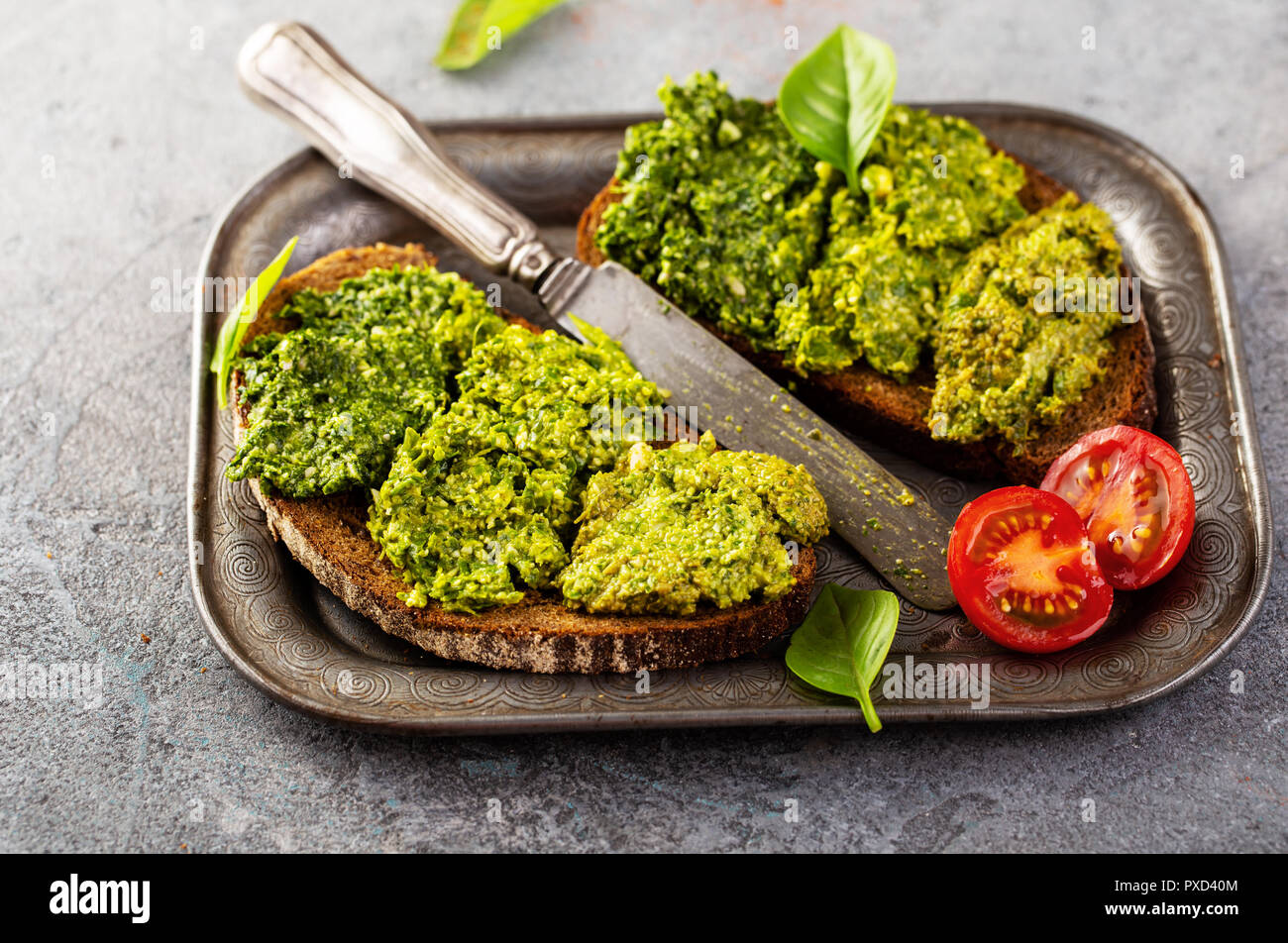 Rye toast with fresh pesto Stock Photo - Alamy