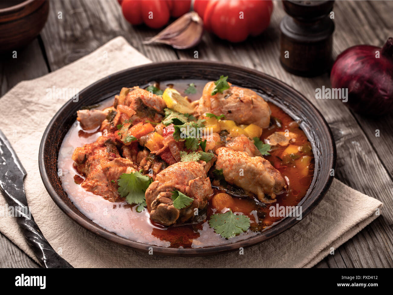 Rustic stewed chicken Stock Photo - Alamy