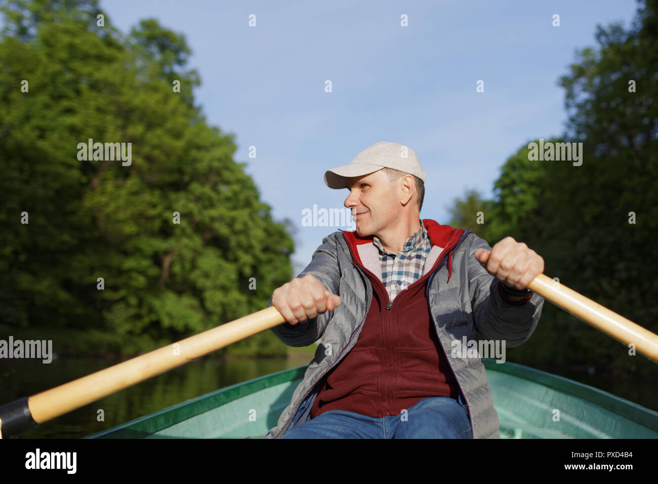 Man in a rowboat hi-res stock photography and images - Alamy