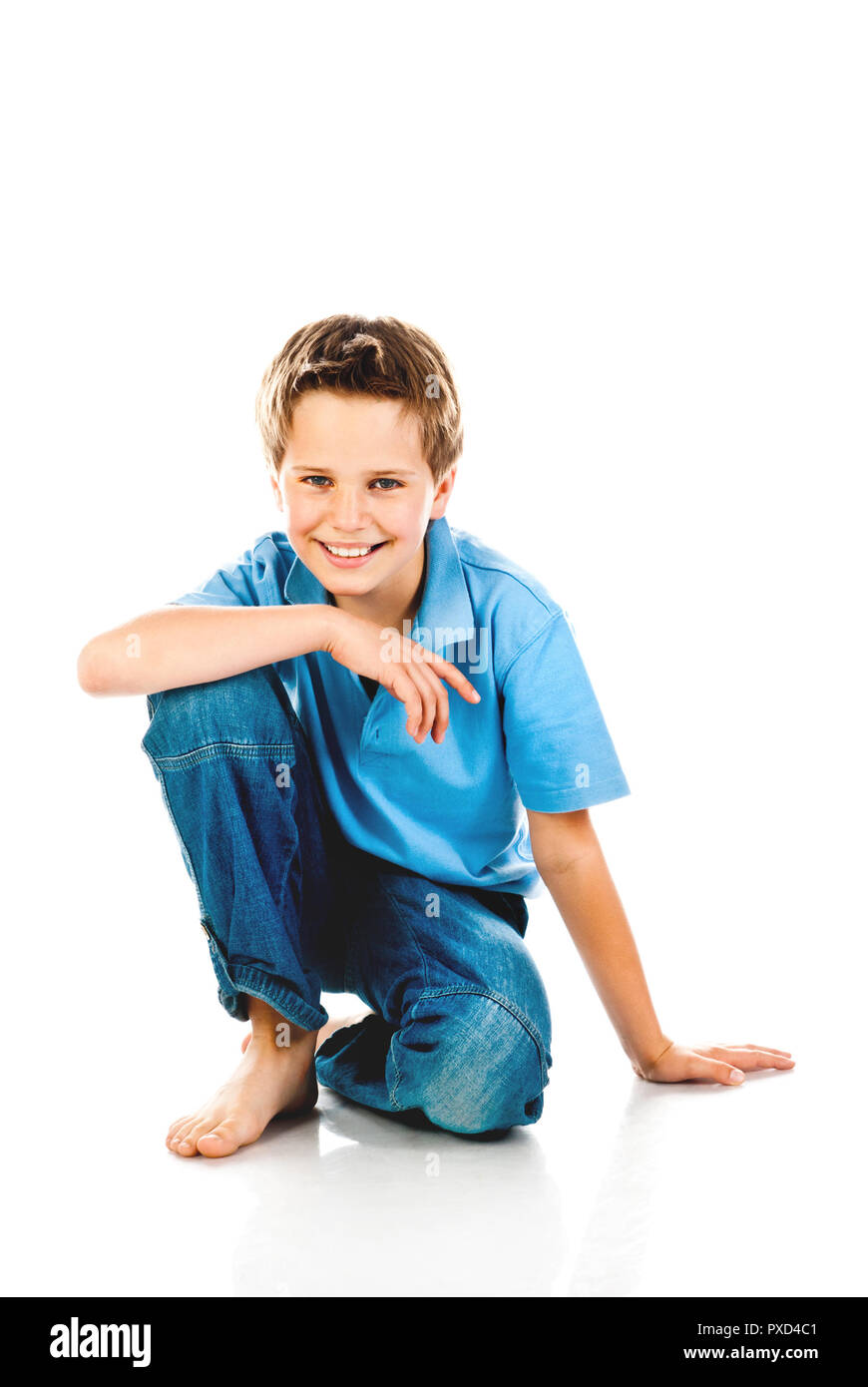 sitting boy isolated on a white background Stock Photo - Alamy