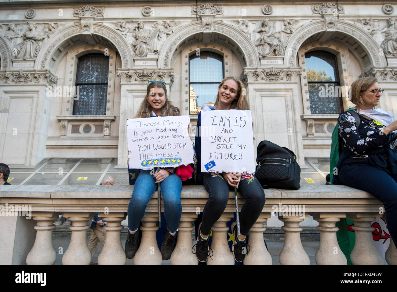 Two teenagers pose with placards during the People's Vote march on ...