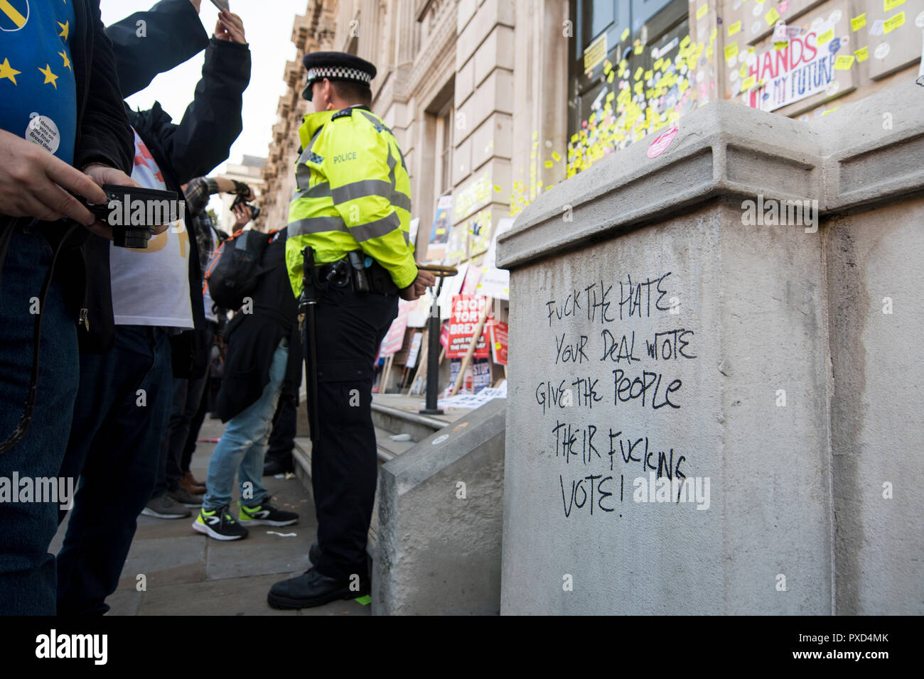Graffiti and People's Vote stickers and posters stuck to the door of ...