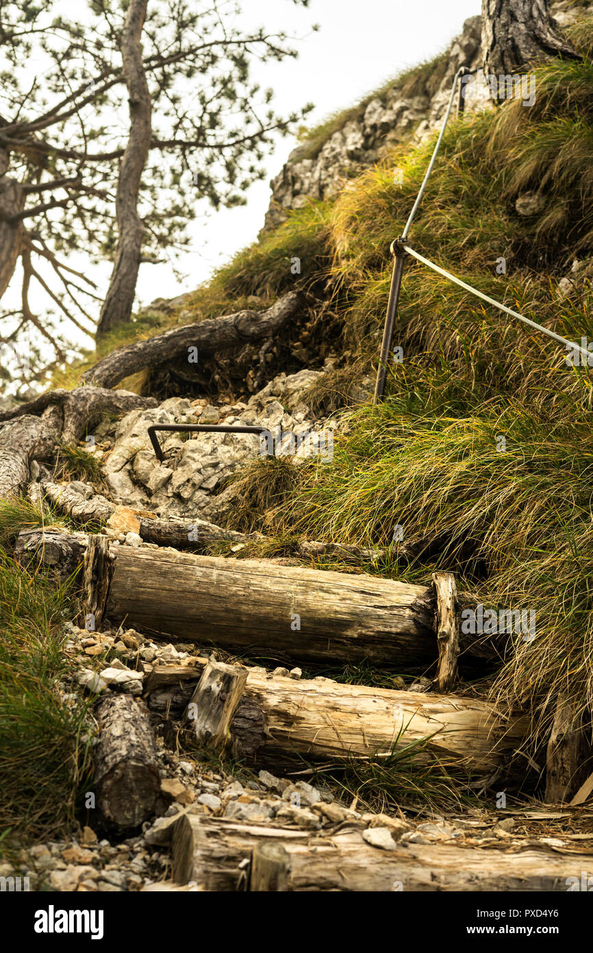 Improvised mountain staircase with a metal rope for holding on Stock ...