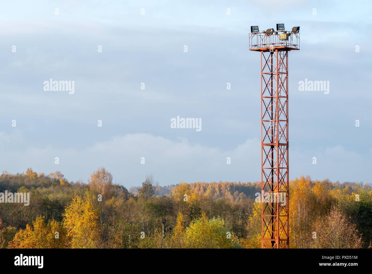 Large tall high outdoor spotlights over the trees Stock Photo - Alamy