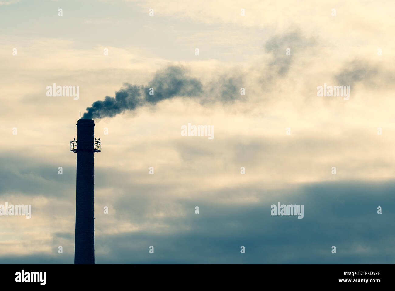 Smoke comes from factory pipe.Climate changing and pollution concept ...