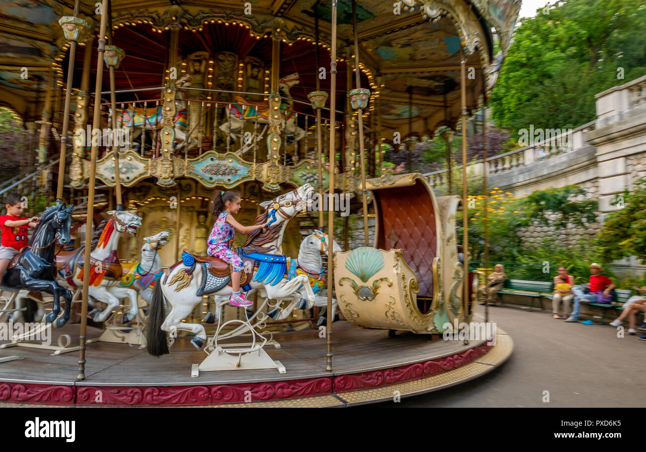 Paris, France - August 12, 2018 : Carousel merry-go-round ride with ...